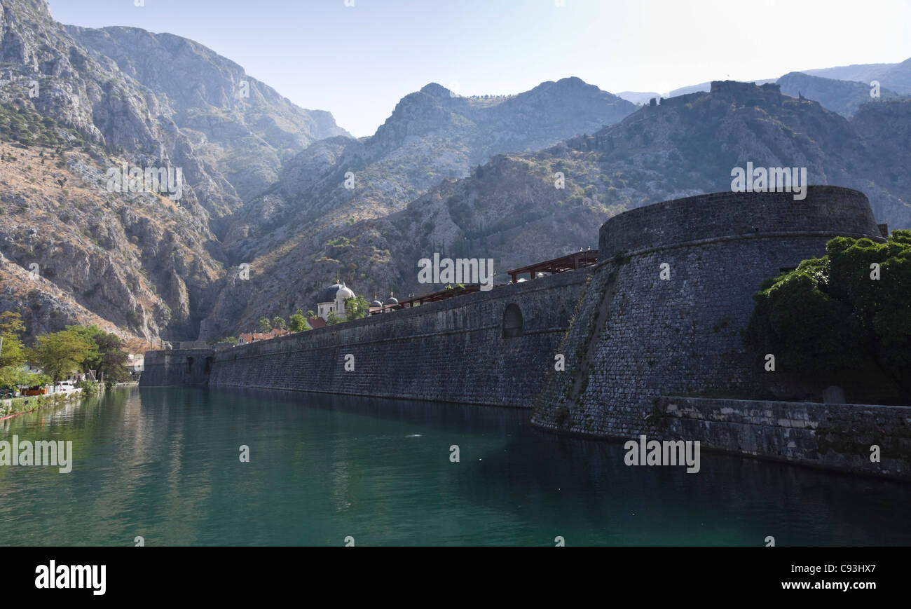 Montenegro - Kotor. City walls and Rijeka Skurda, moat river canal ...