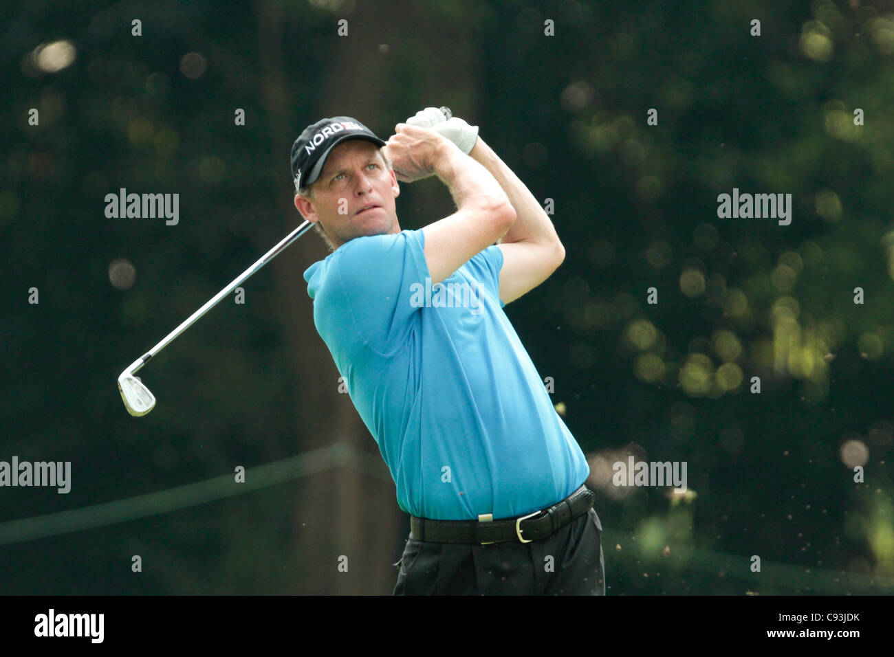 11.11.2011. Singapore. Anders Hansen(DEN) drives his approach shot from ...