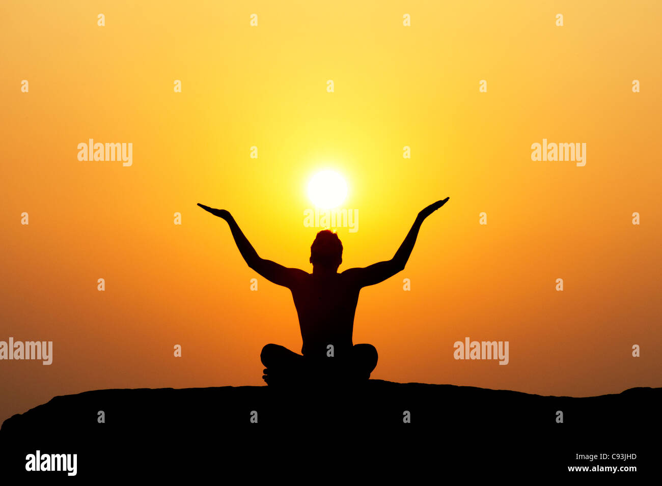Indian man embracing the sun. Silhouette. India Stock Photo - Alamy