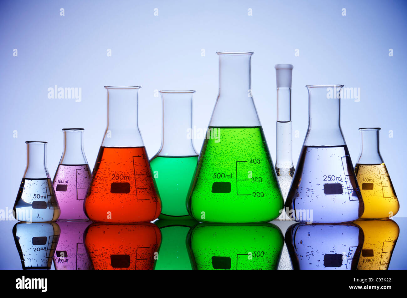 group of laboratory flasks with colored liquid inside Stock Photo - Alamy