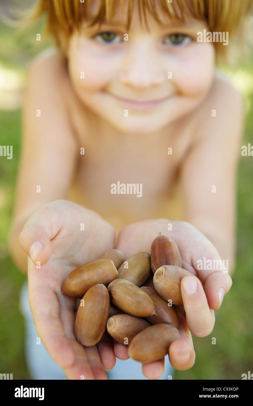 Boy holding acorn hi-res stock photography and images - Alamy