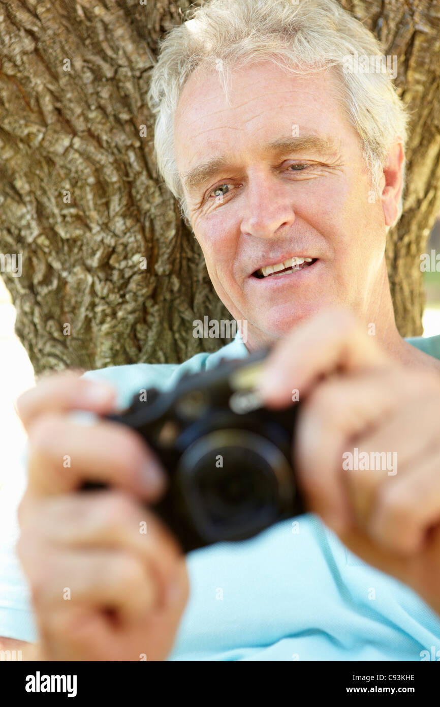 Senior man with camera Stock Photo - Alamy