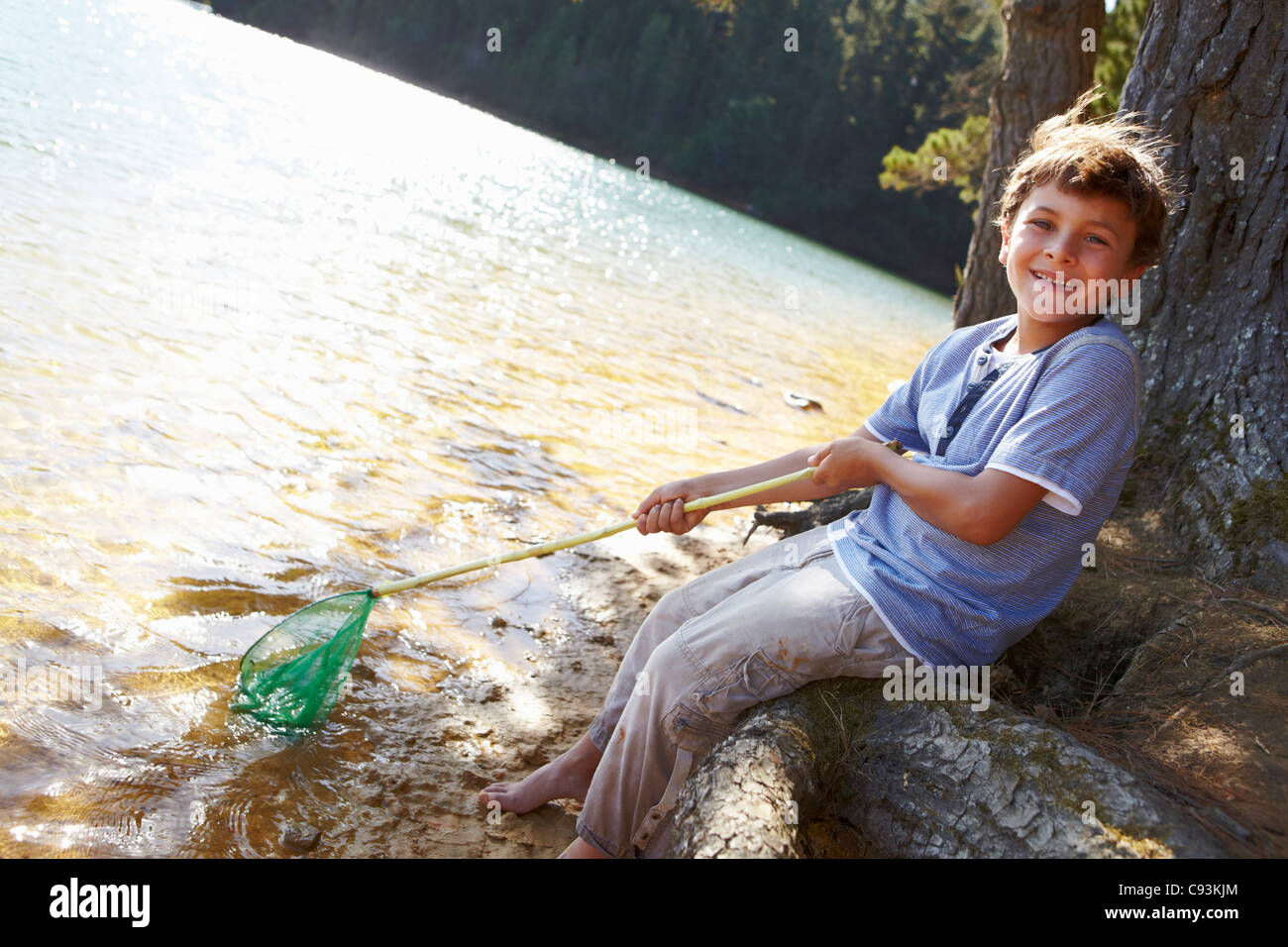 Boy fish net hi-res stock photography and images - Alamy