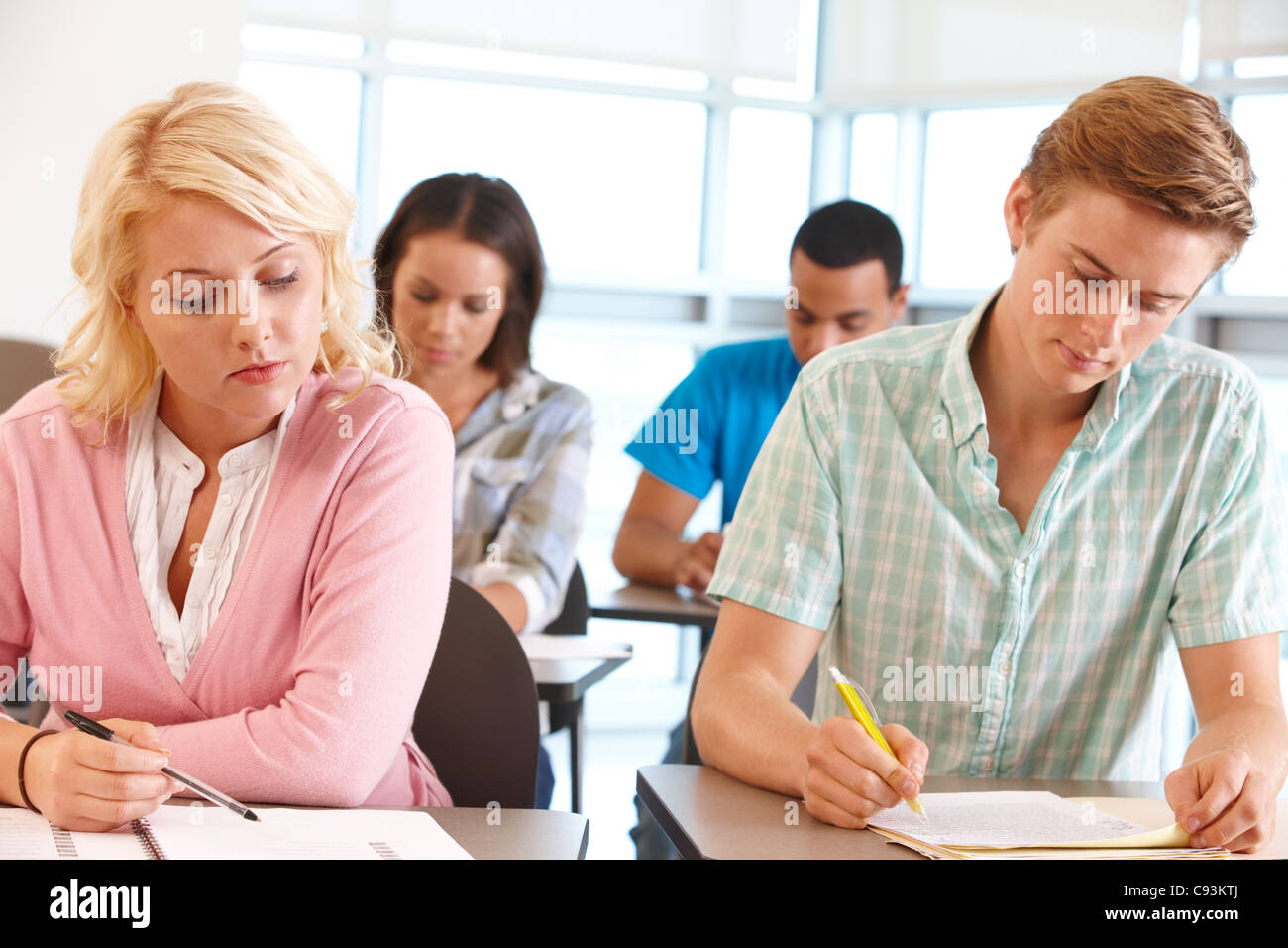 Students working in classroom Stock Photo - Alamy