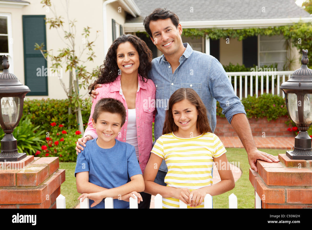 Hispanic family outside home Stock Photo - Alamy