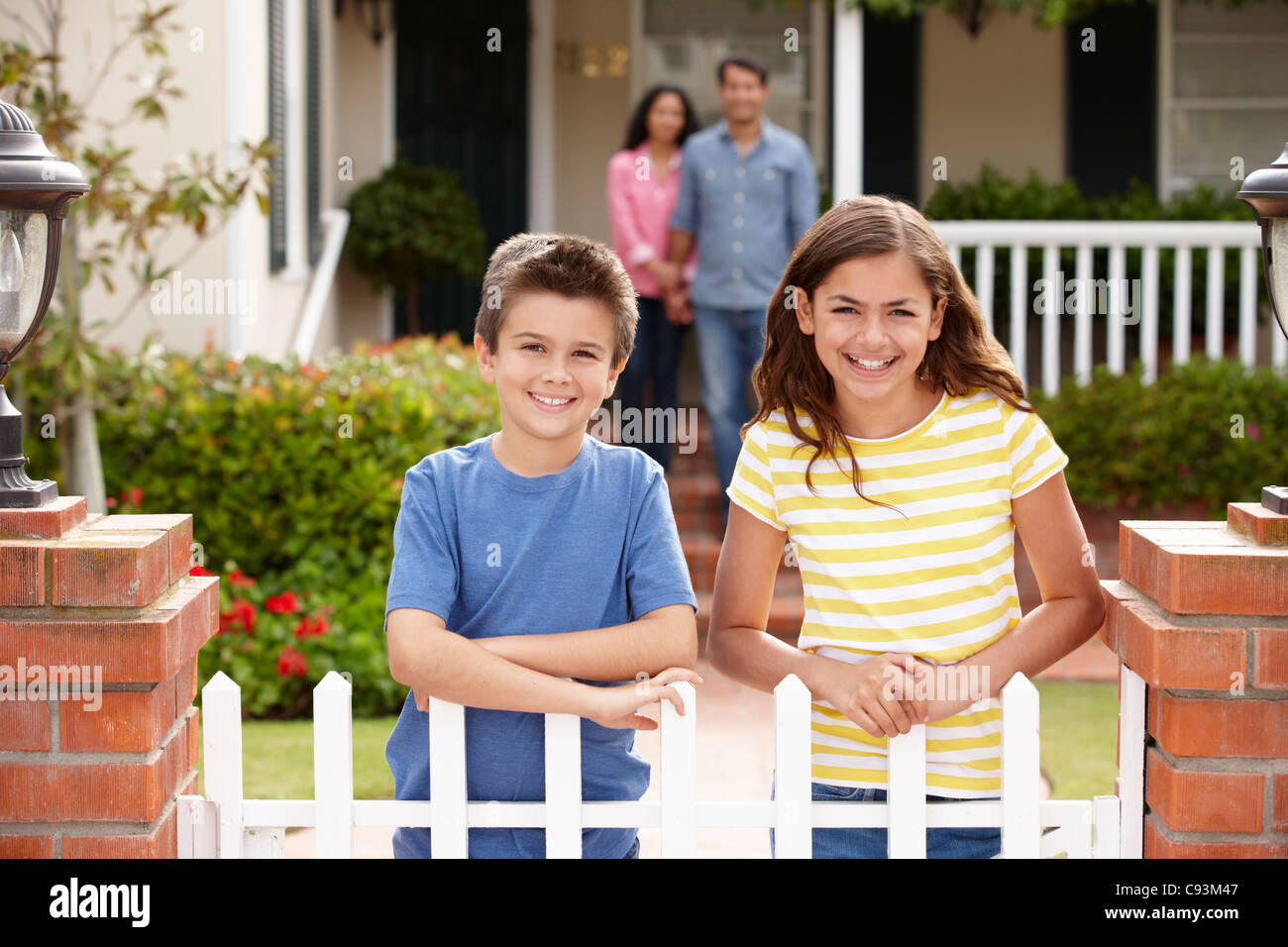 Hispanic family outside home Stock Photo - Alamy