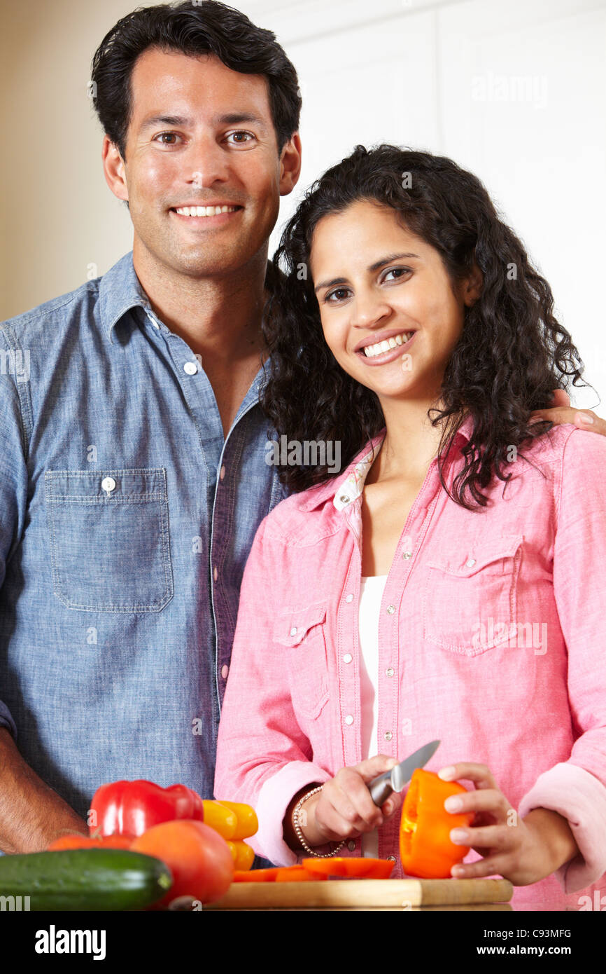 Hispanic couple cooking Stock Photo - Alamy