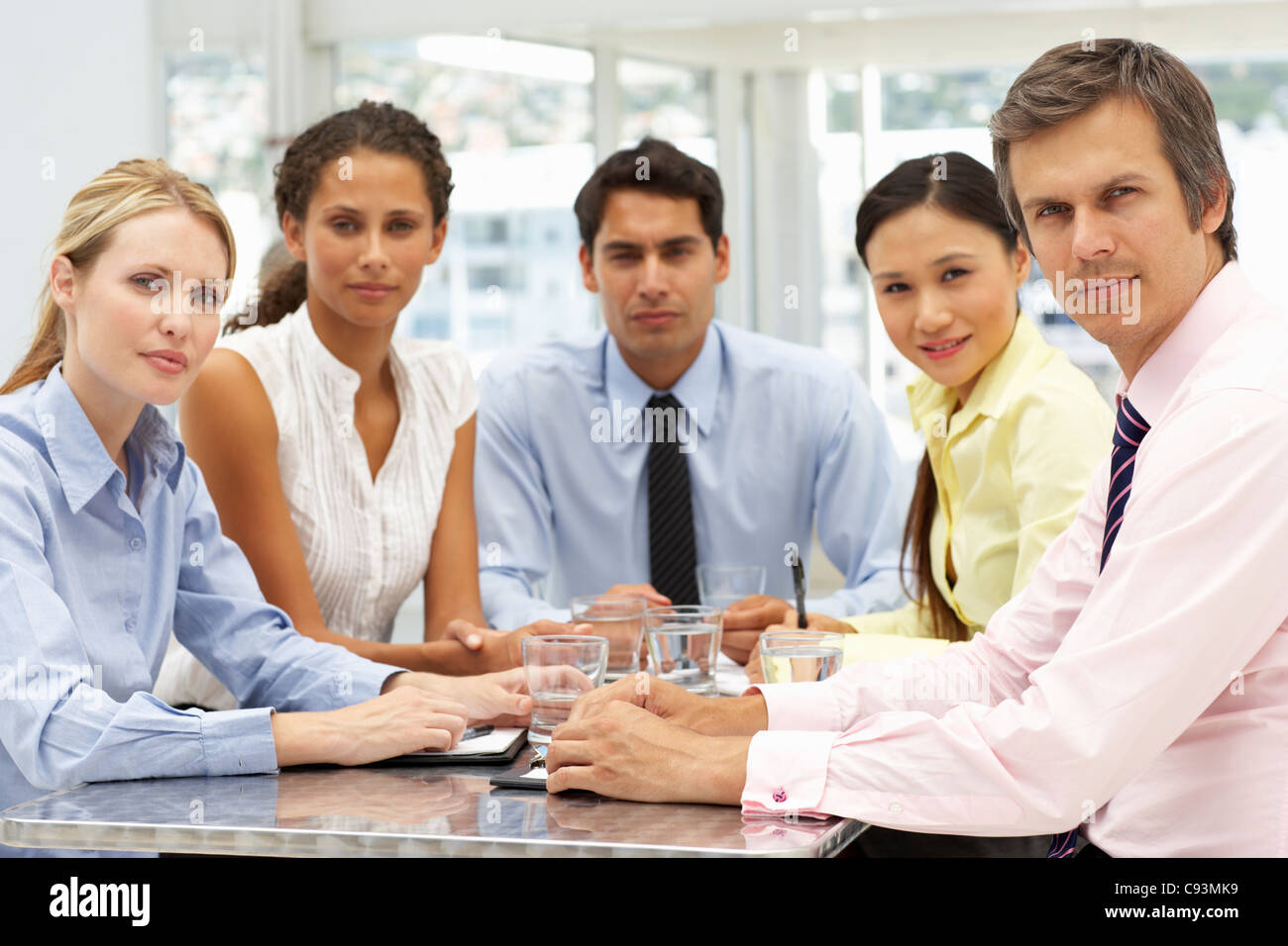 Mixed group in business meeting Stock Photo - Alamy