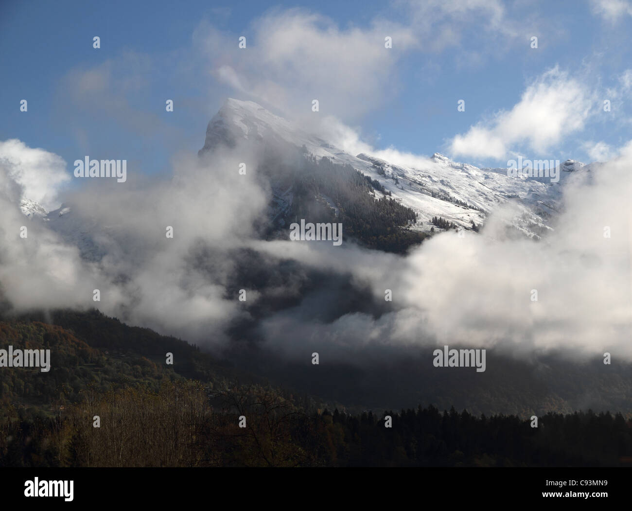 Snow capped mountains surrounding the French village of Sameon Stock ...