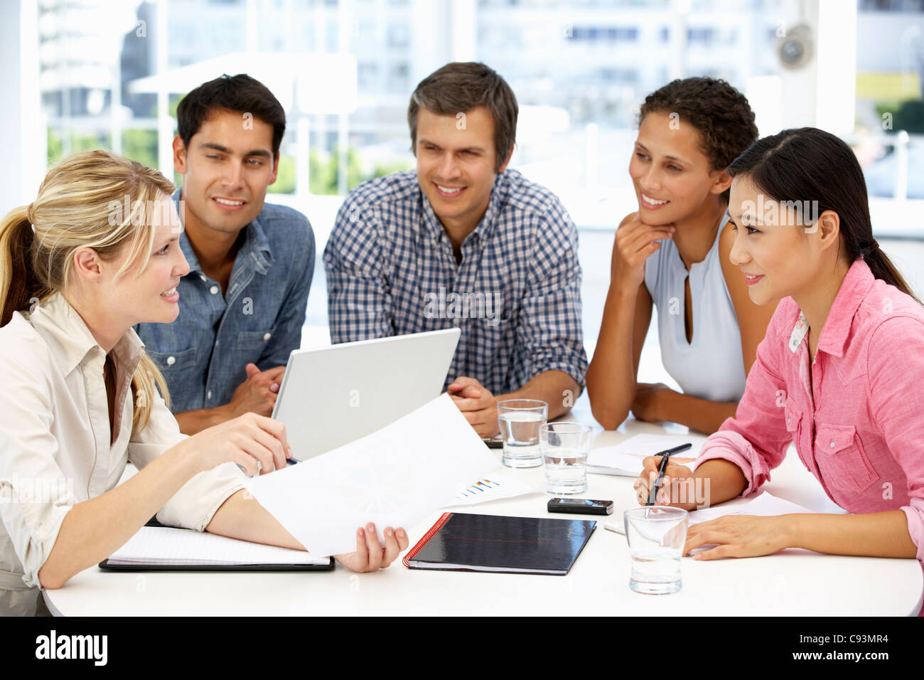 Mixed group in business meeting Stock Photo - Alamy