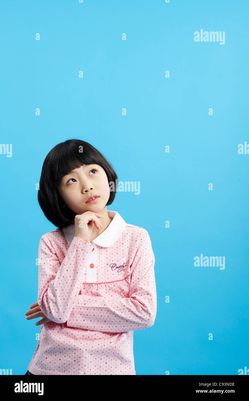 Young girl, thinking, studio shot Stock Photo - Alamy