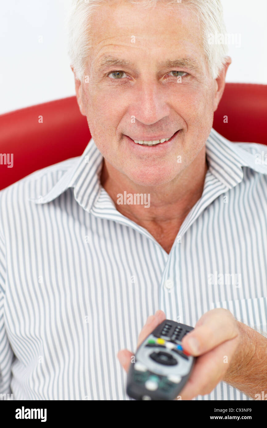 Senior man with remote control Stock Photo - Alamy