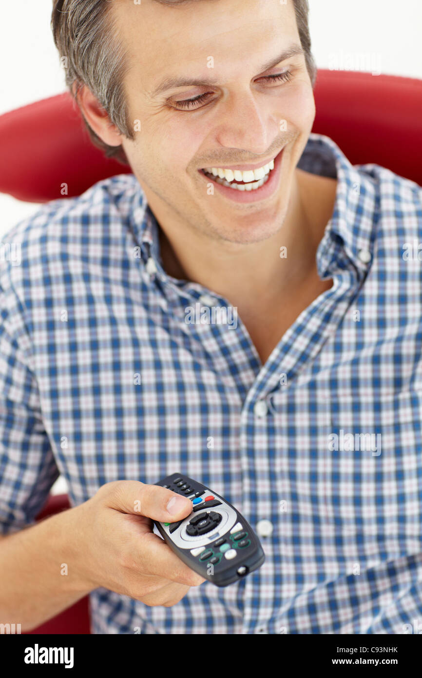 Man with remote control Stock Photo - Alamy