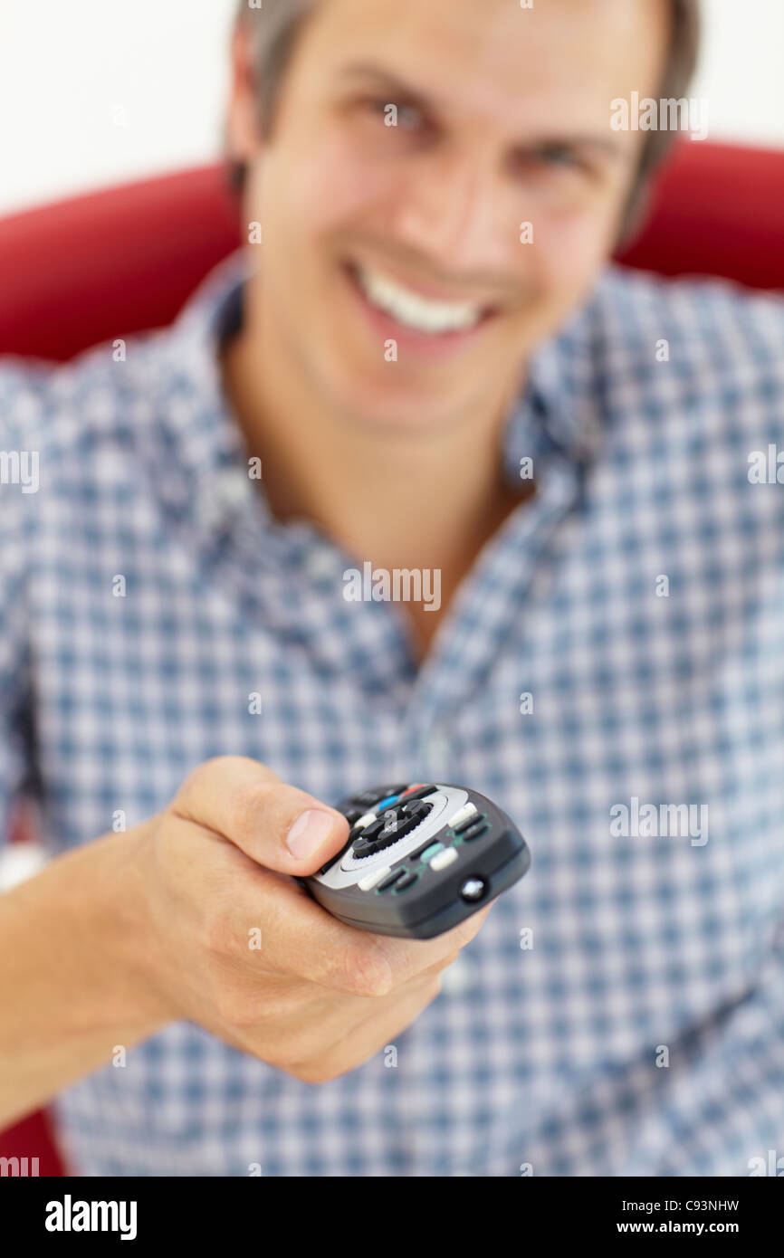 Man with remote control Stock Photo - Alamy