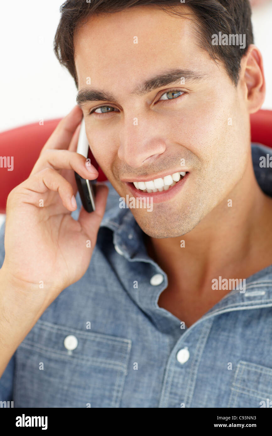 Young man talking on the phone Stock Photo - Alamy