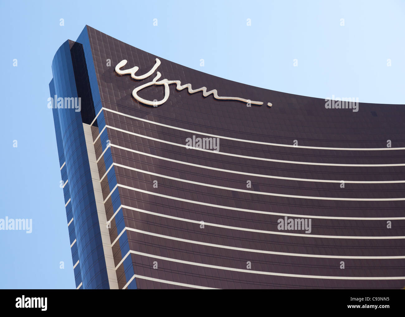 The Wynn Hotel sign and architecture against a blue Las Vegas sky ...