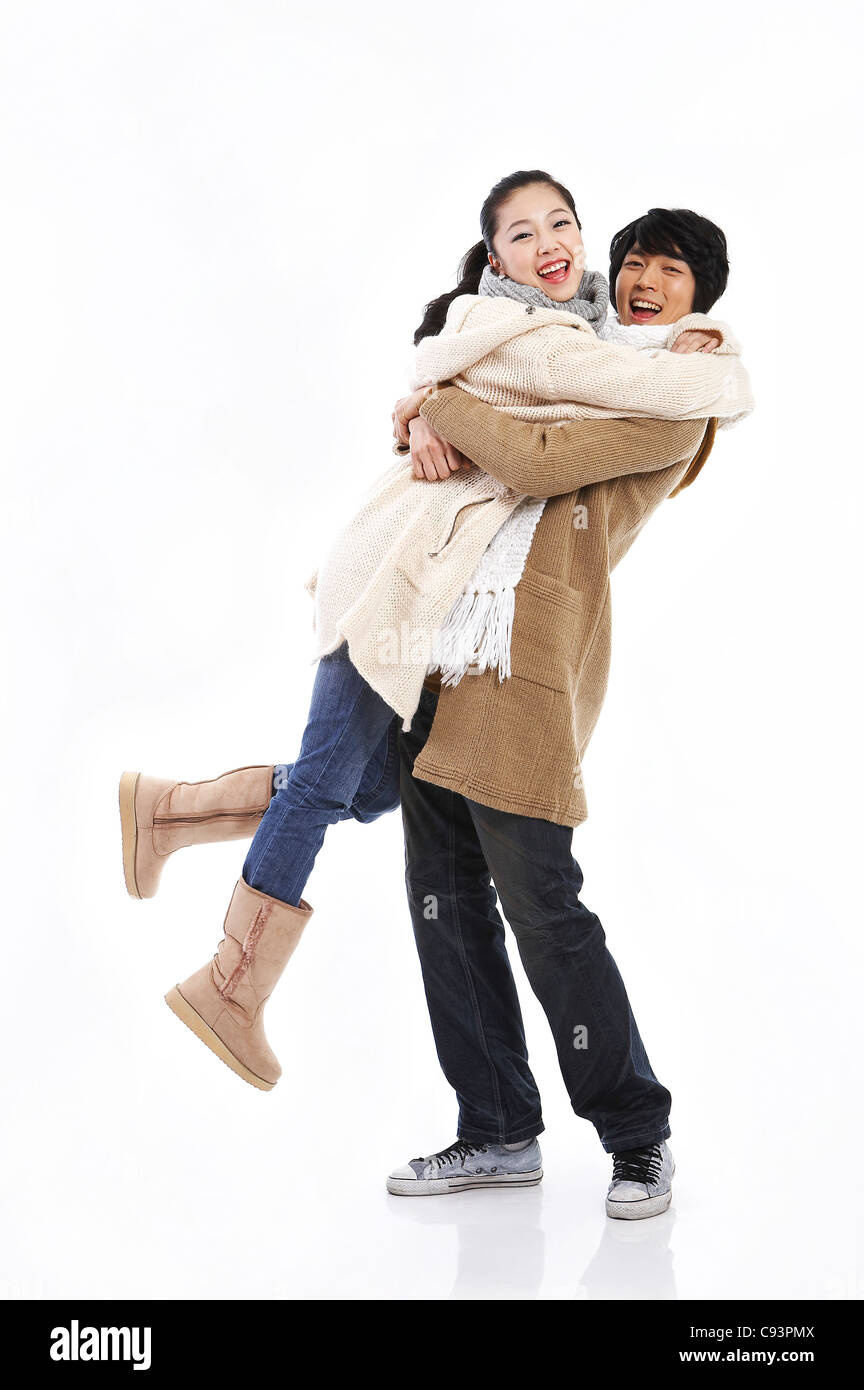 Boys lifting girls Cut Out Stock Images & Pictures - Alamy