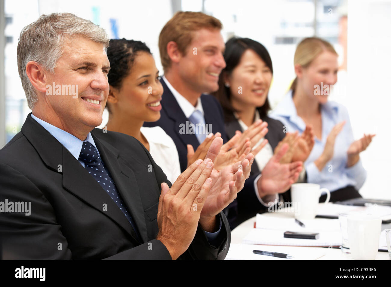 Business people clapping Stock Photo - Alamy
