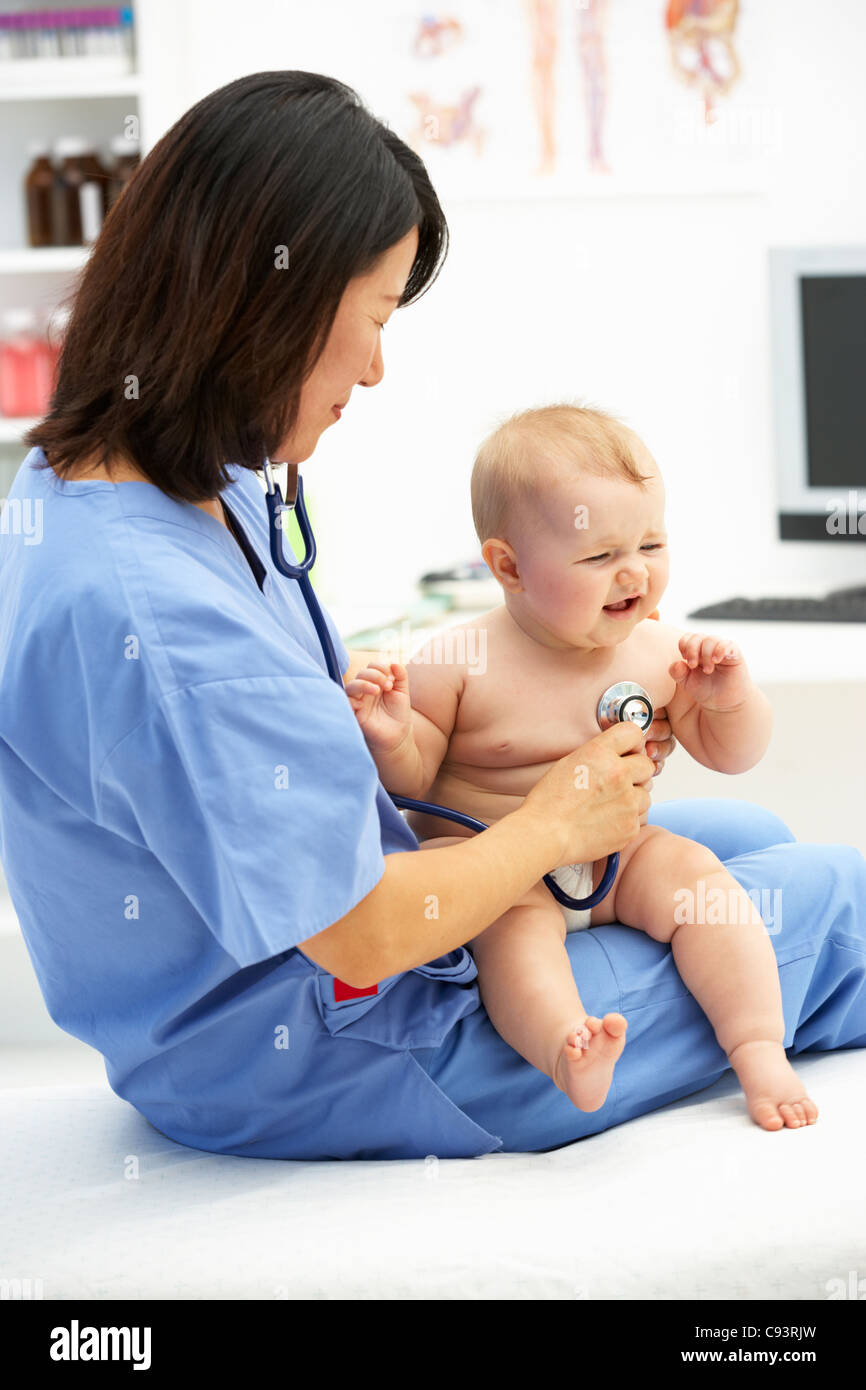Pediatrician with baby Stock Photo - Alamy