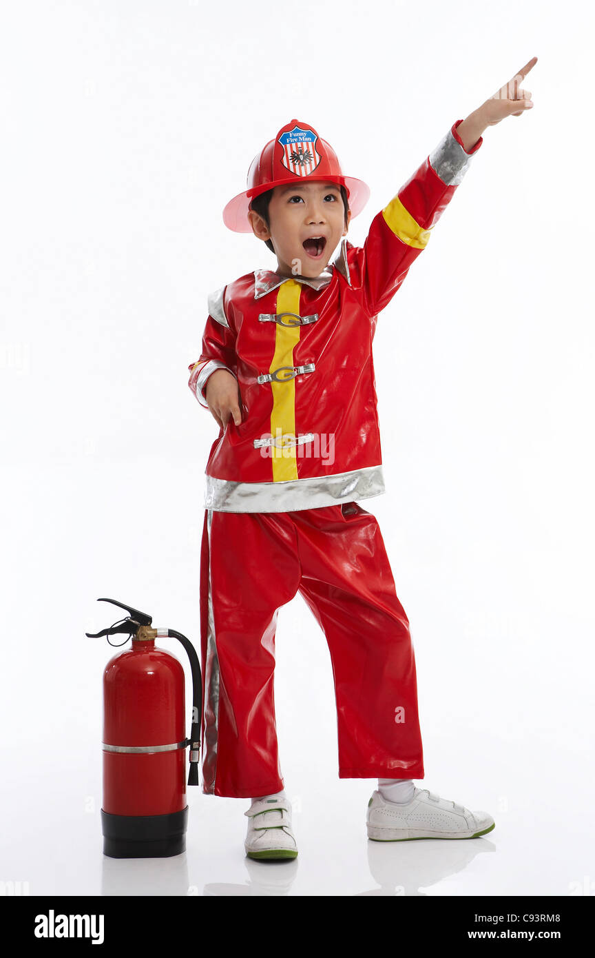 Portrait of a boy dressed as a firefighter, studio shot Stock Photo - Alamy