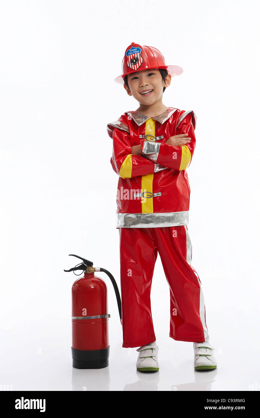 Portrait of a boy dressed as a firefighter, studio shot Stock Photo - Alamy