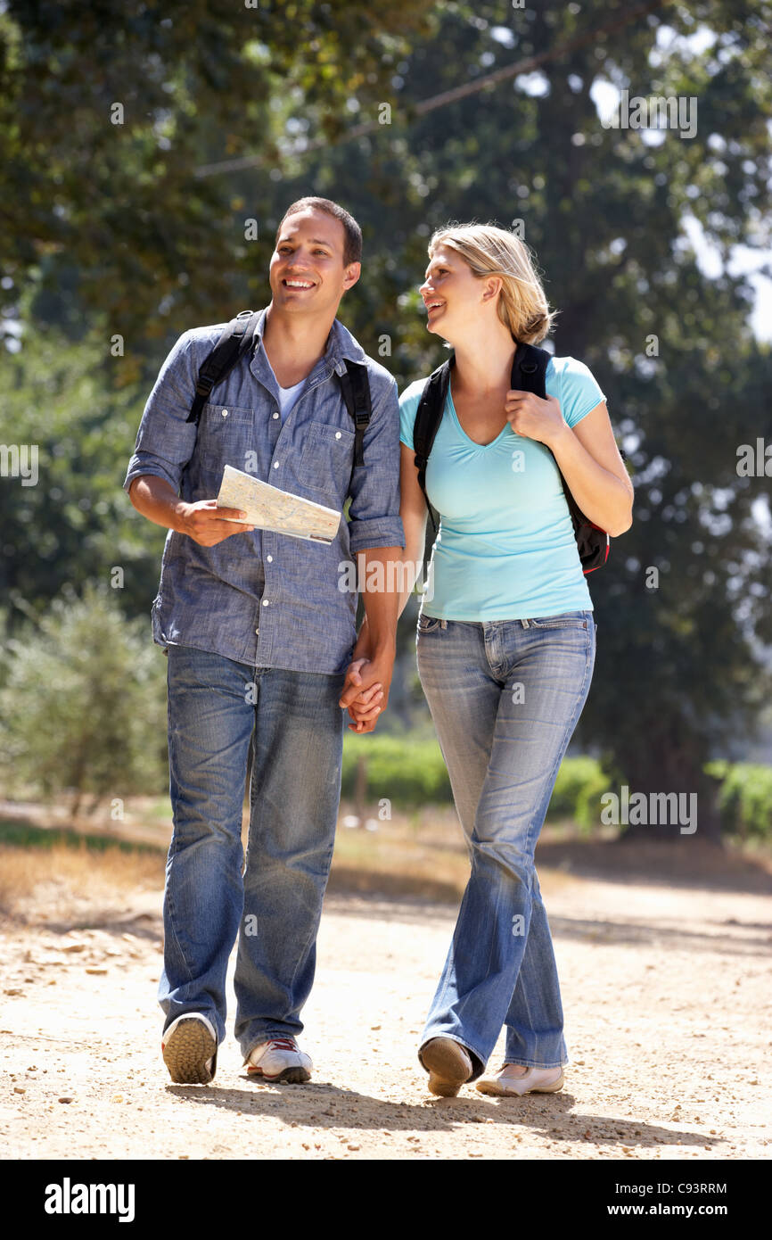 Couple with map on country walk Stock Photo - Alamy