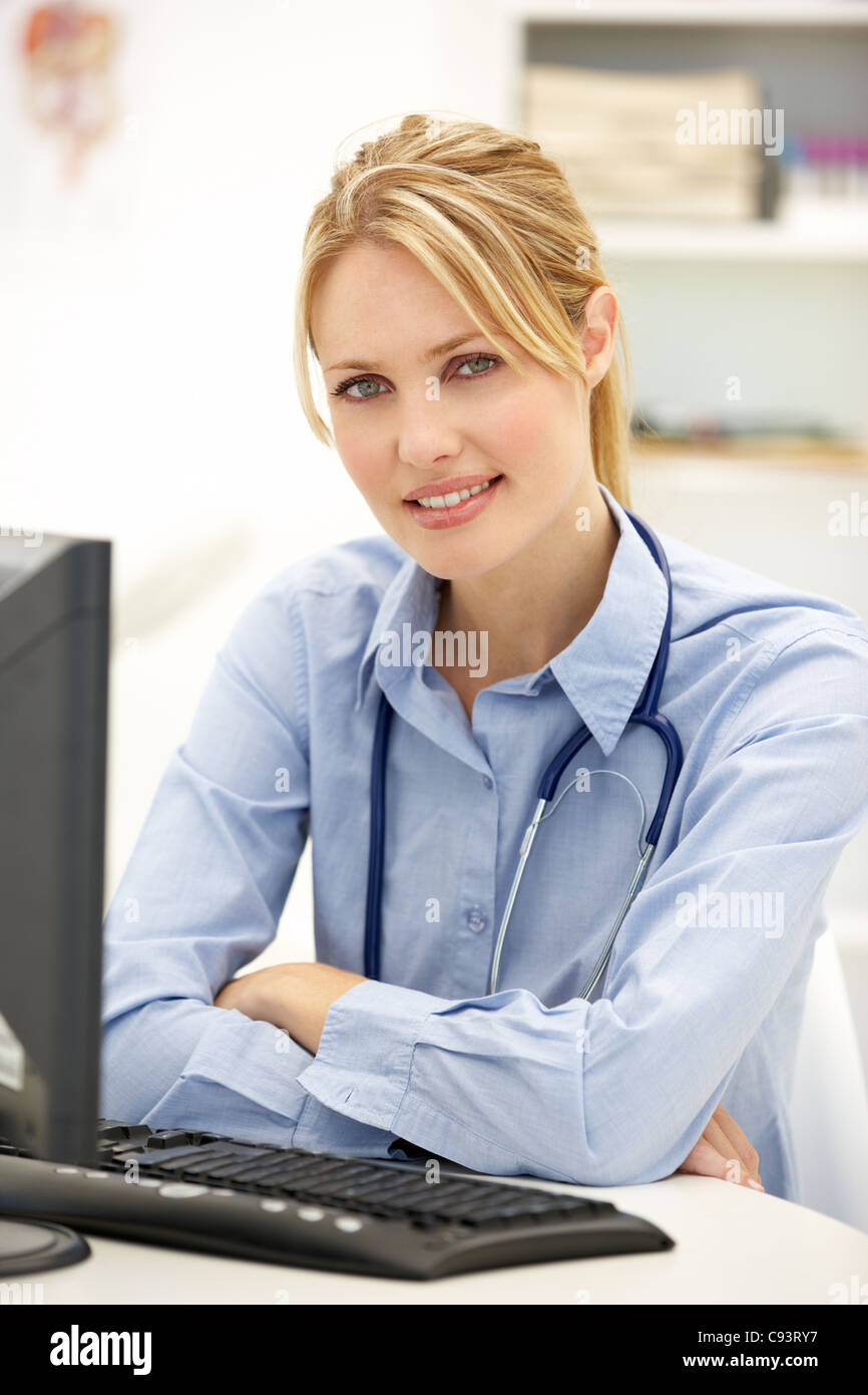 Young doctor at desk Stock Photo - Alamy