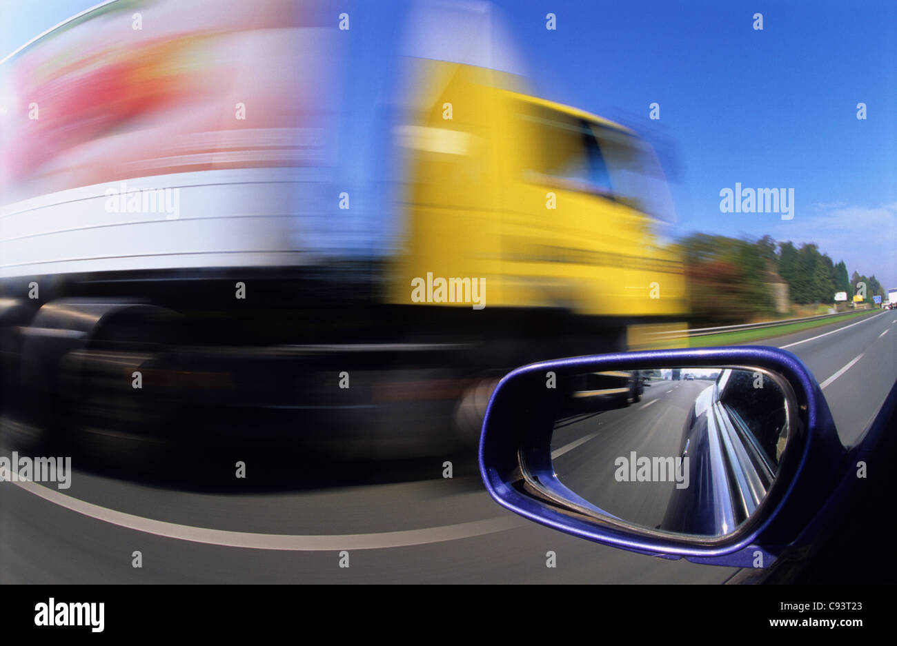 car overtaking lorry travelling on the a1/m1 motorway near leeds ...