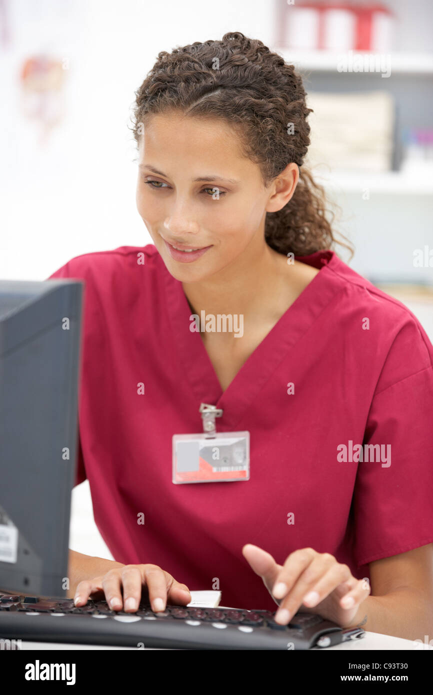 Young hospital doctor at desk Stock Photo - Alamy