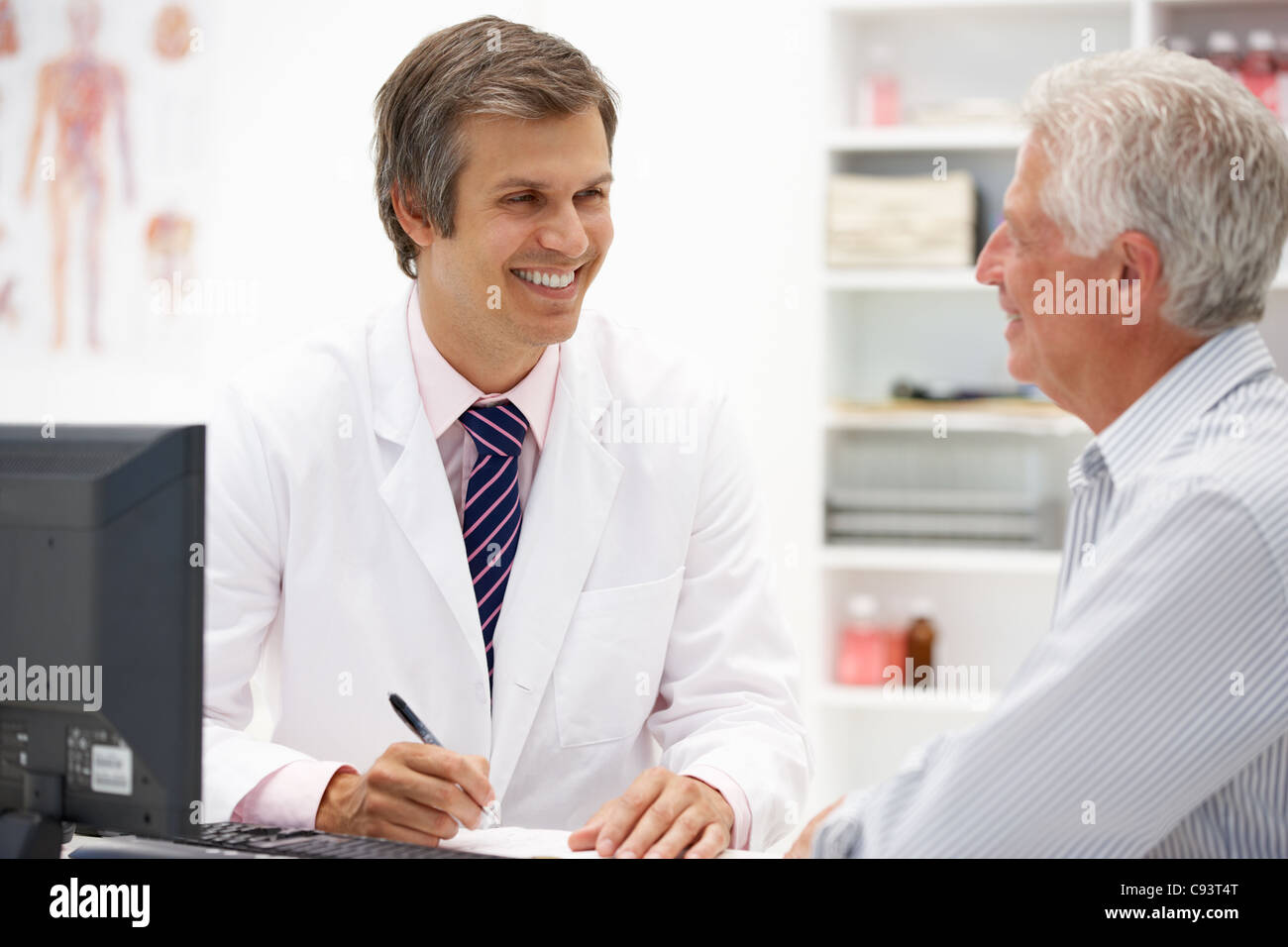 Doctor with senior patient Stock Photo - Alamy