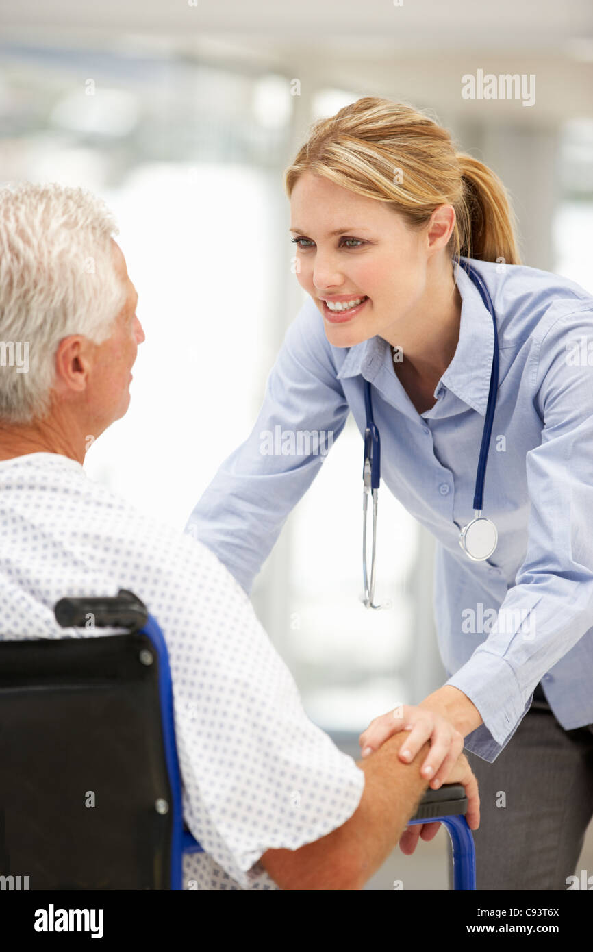 Senior patient with young doctor Stock Photo - Alamy