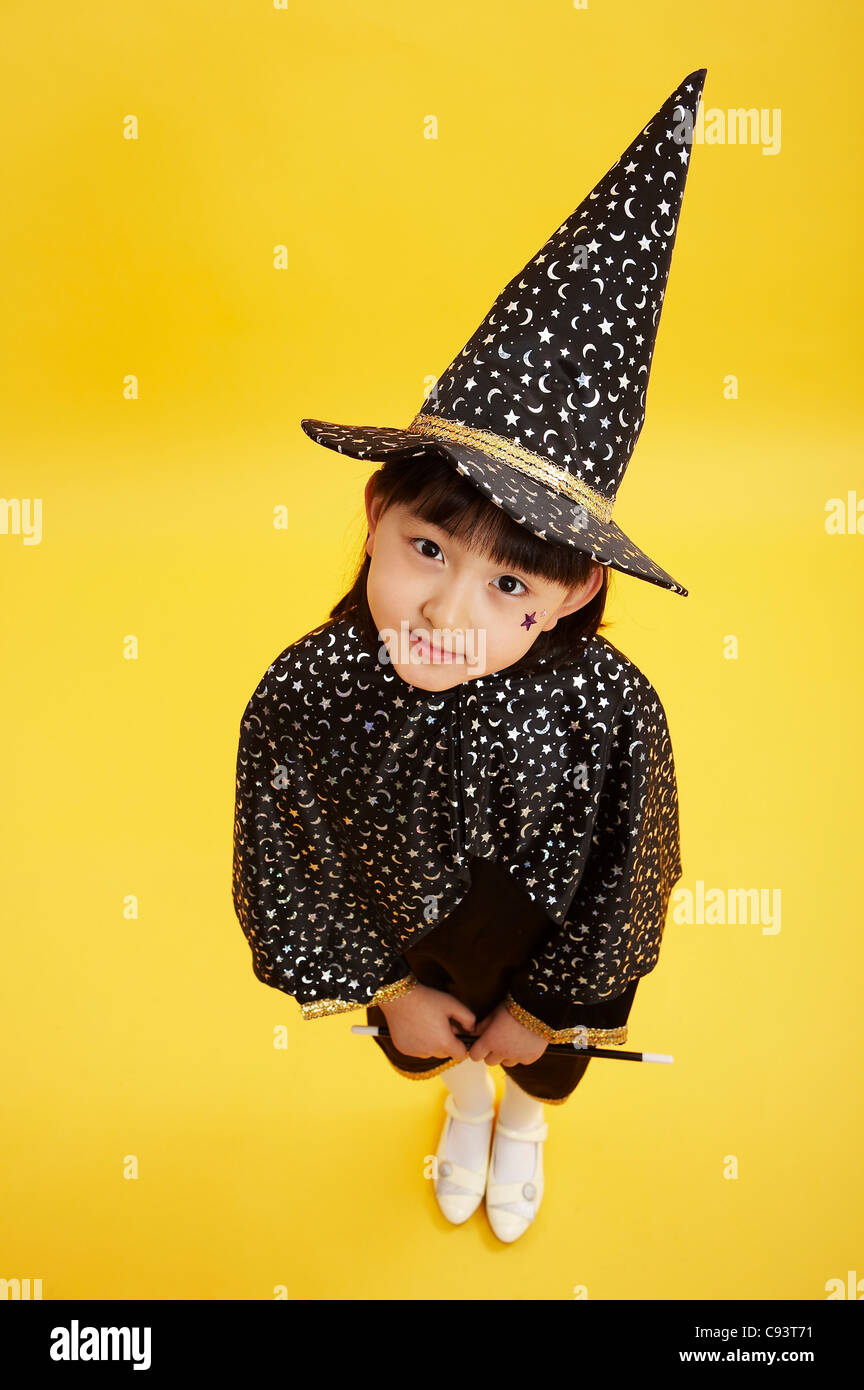 Portrait of a girl magician with magic wand Stock Photo - Alamy
