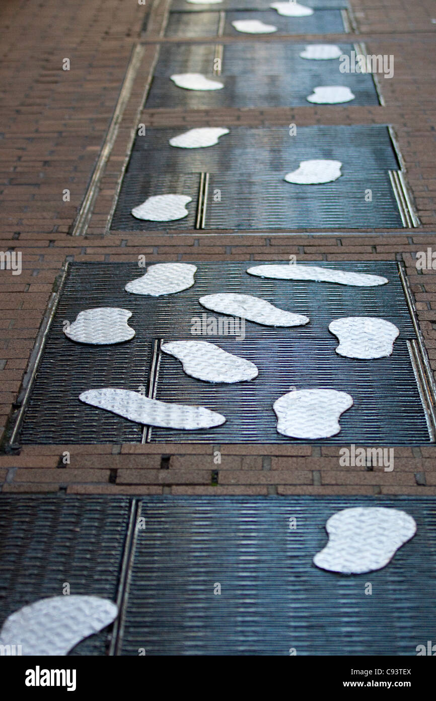 Metal Footprints along a path in New York City USA Stock Photo - Alamy