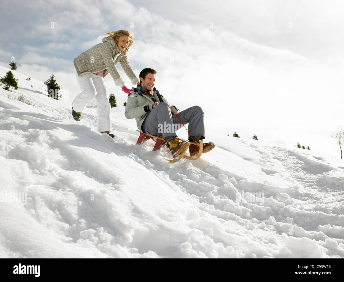 Young people sledding together hi-res stock photography and images - Alamy