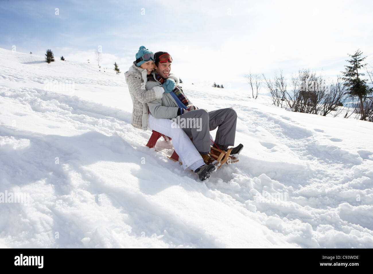 Young people sledding together hi-res stock photography and images - Alamy