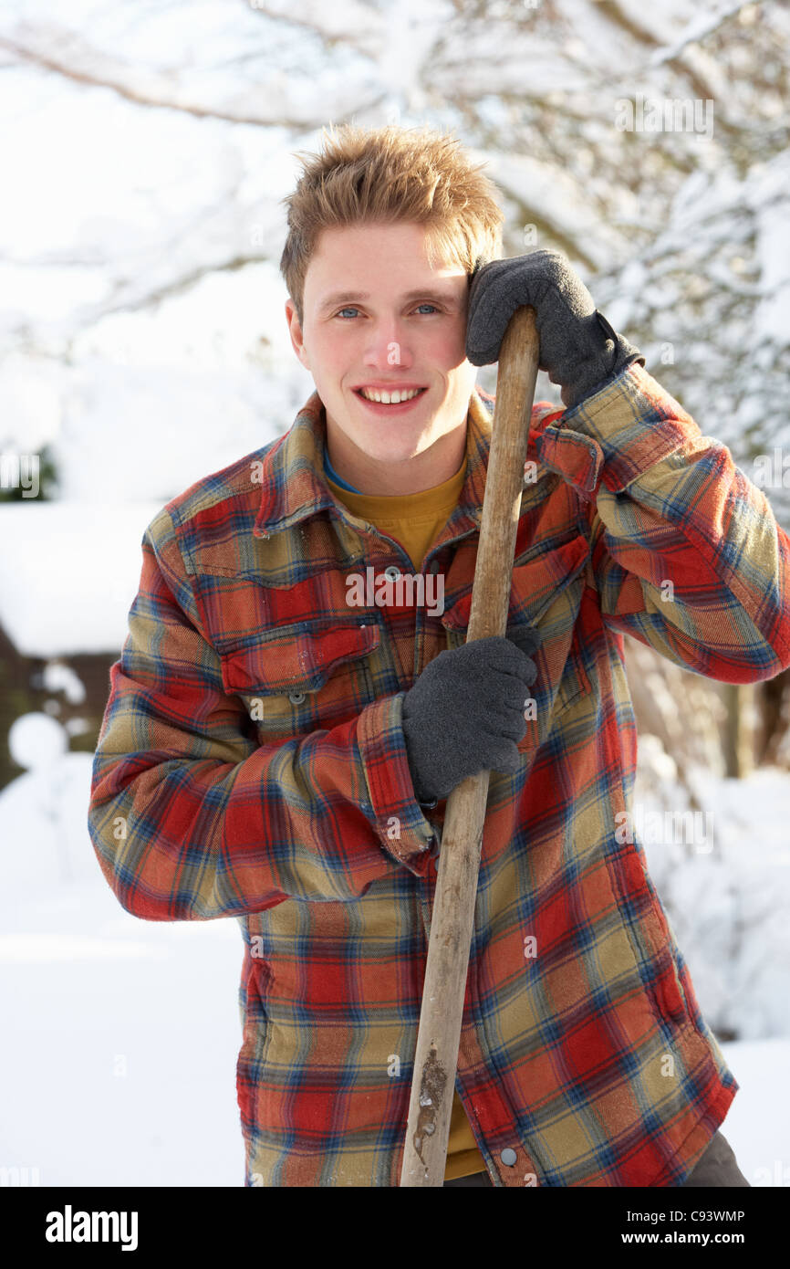Young man clearing snow Stock Photo - Alamy Young man clearing snow Stock Photo - Alamy