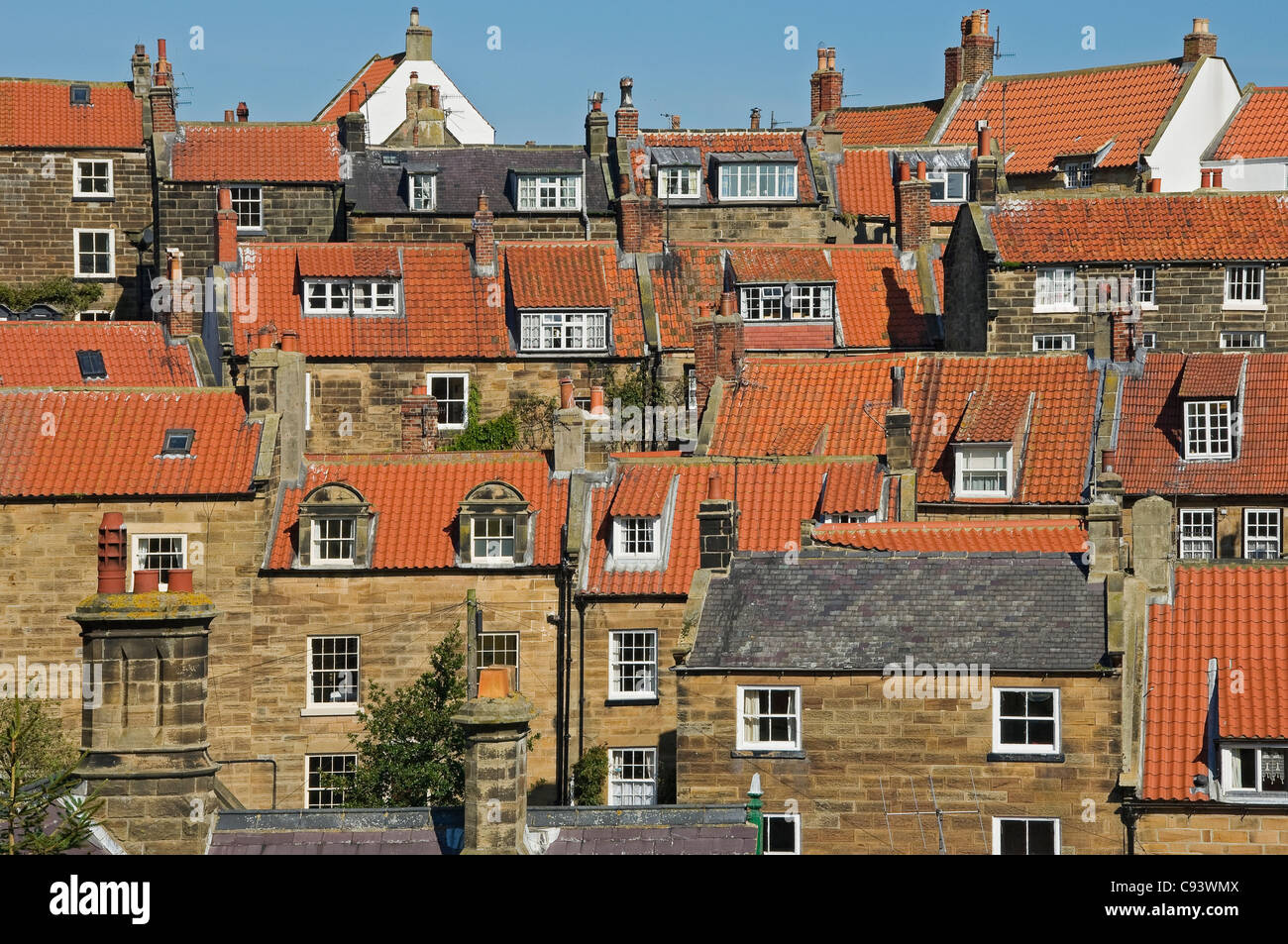 Looking across rooftops of houses homes cottages in summer Robin Hoods ...