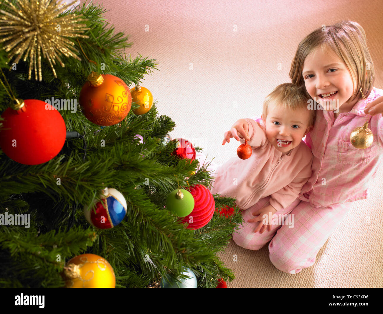 Children with Christmas tree Stock Photo - Alamy