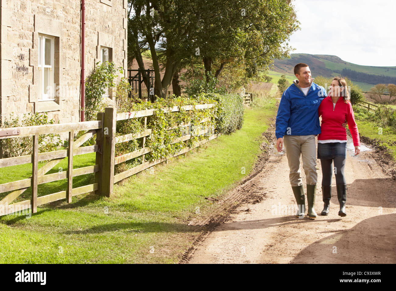 Couple on country walk Stock Photo - Alamy