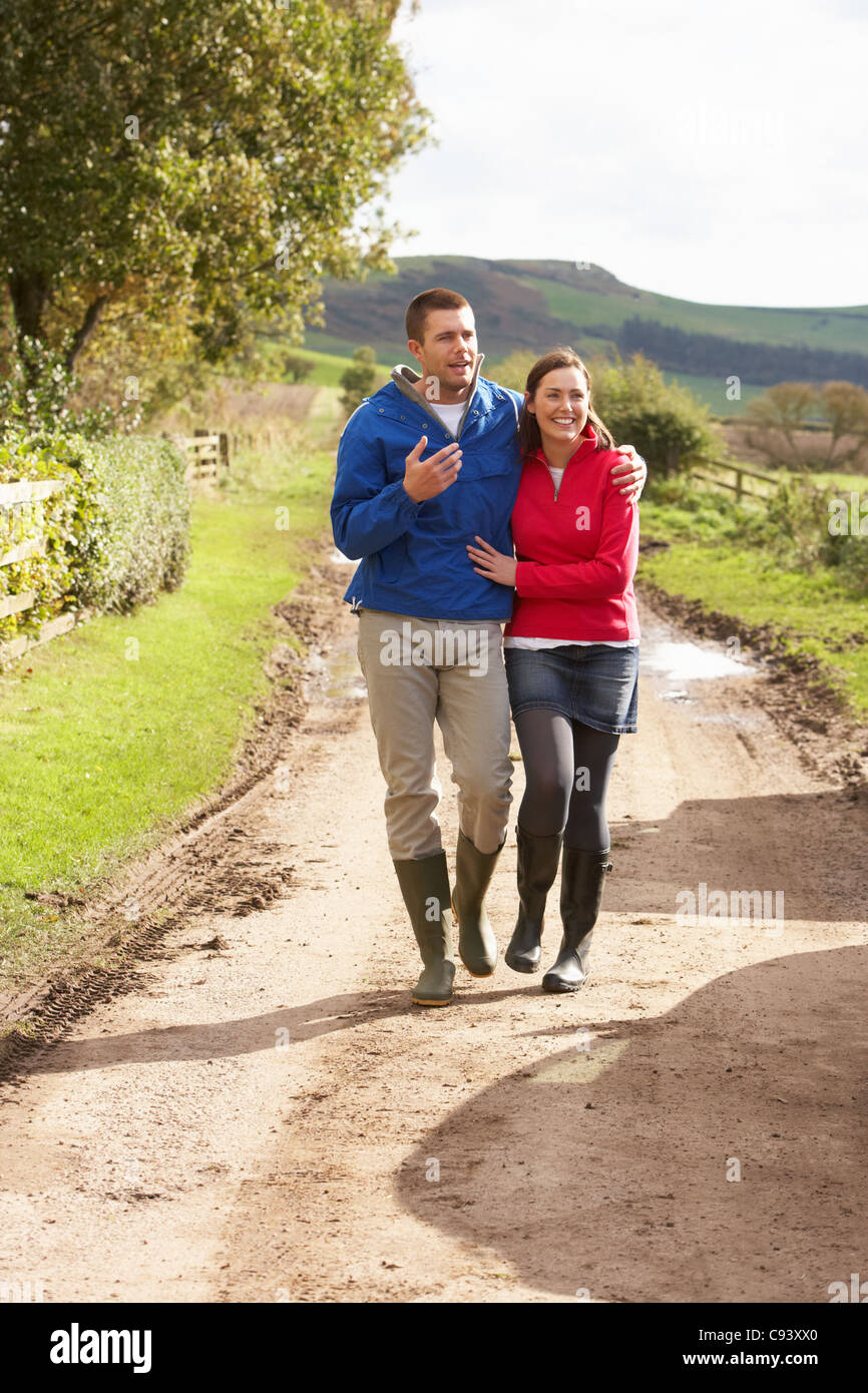 Couple on country walk Stock Photo - Alamy