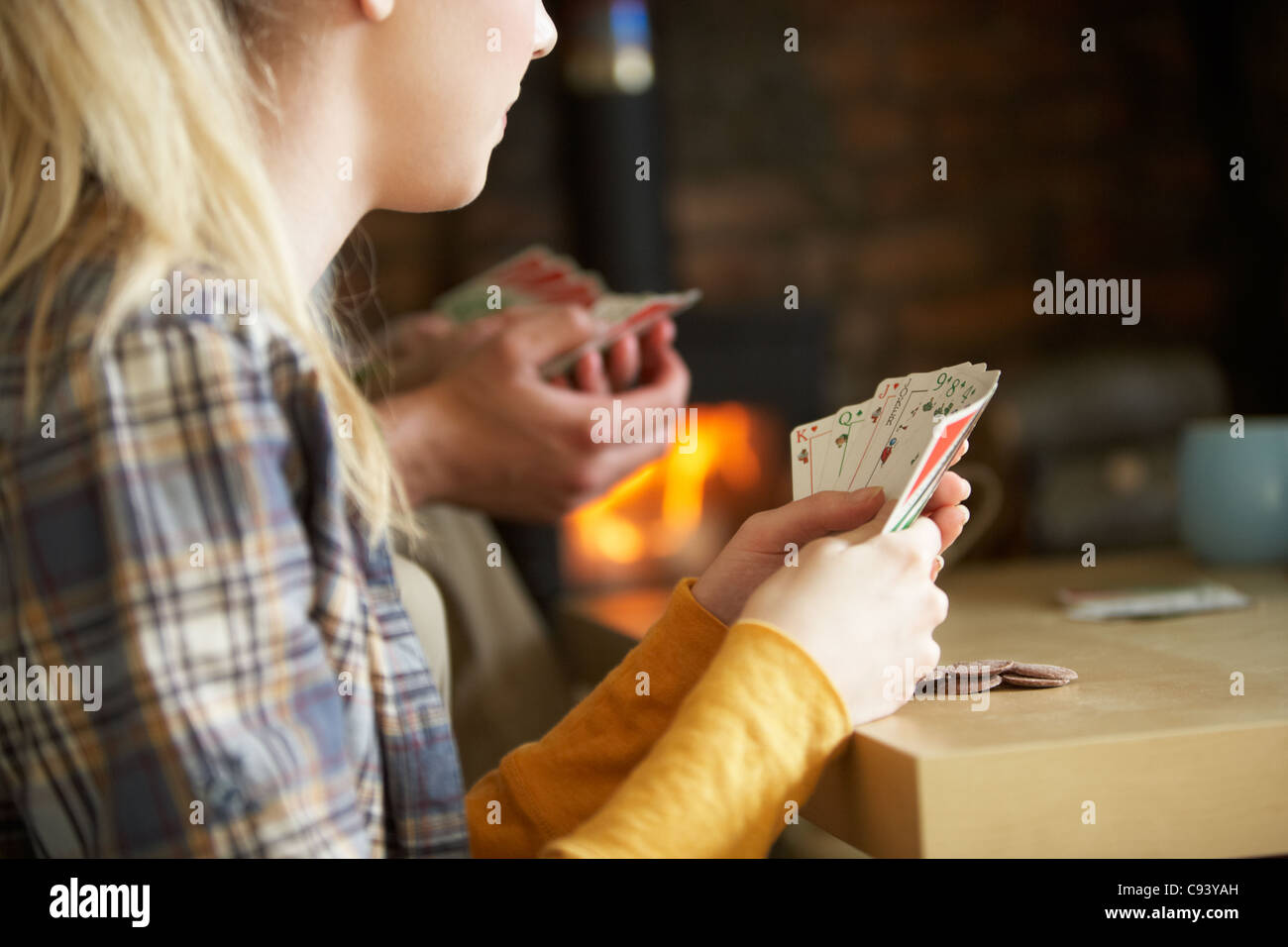 Young people playing cards Stock Photo - Alamy