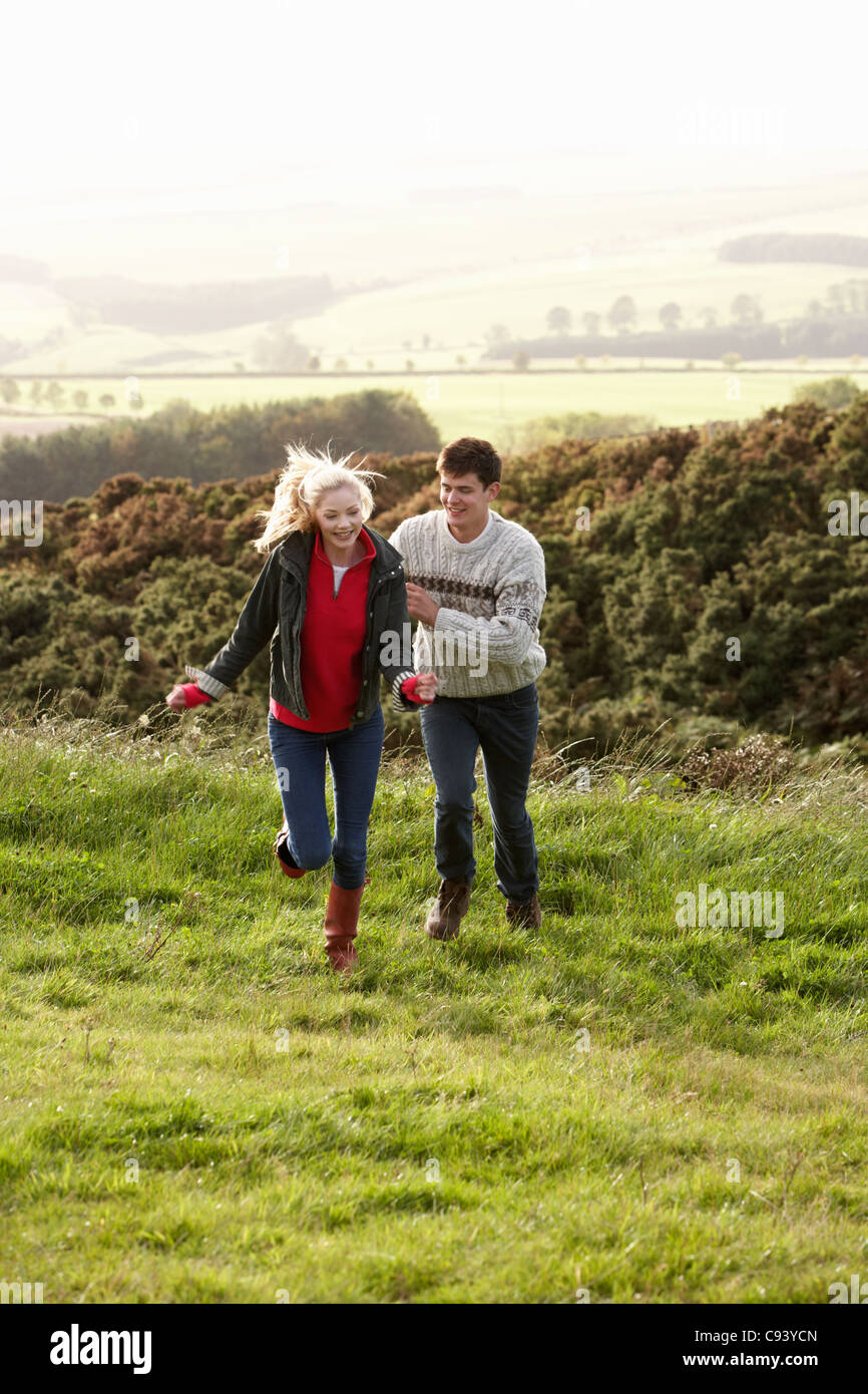 Young couple on country walk Stock Photo - Alamy