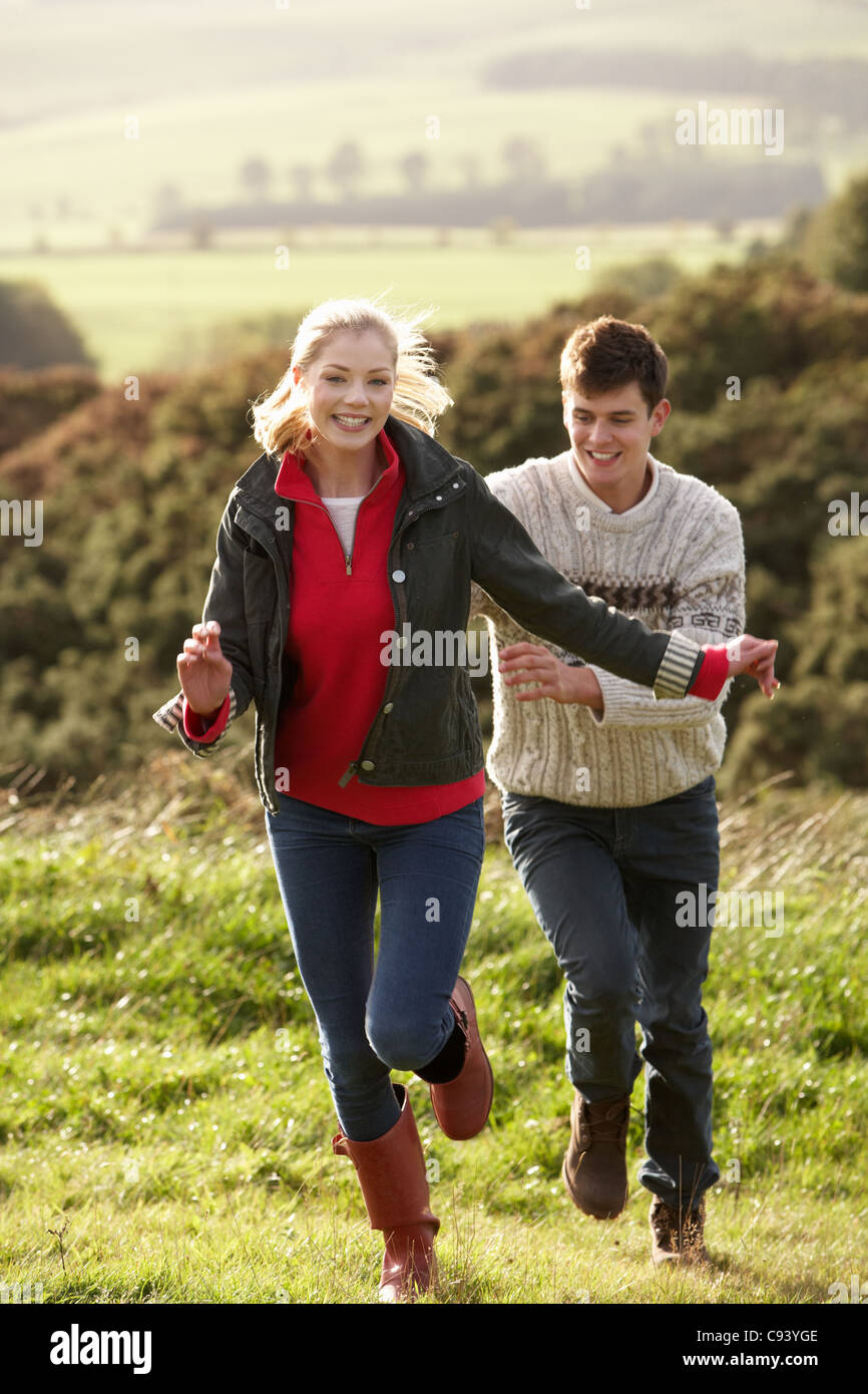 Young couple on country walk Stock Photo - Alamy