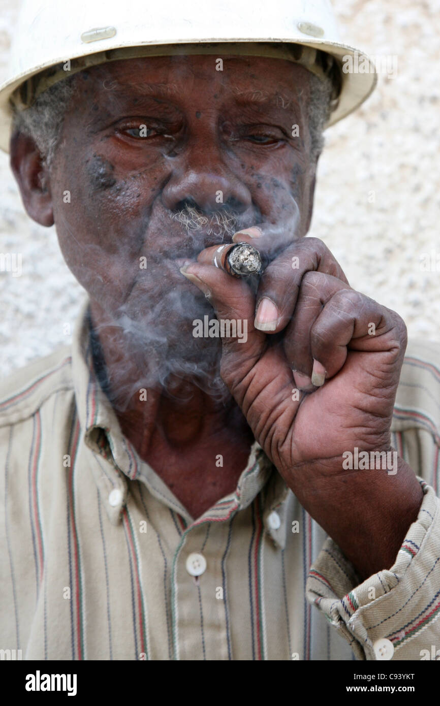 Cuban man smokes a cigar hi-res stock photography and images - Alamy