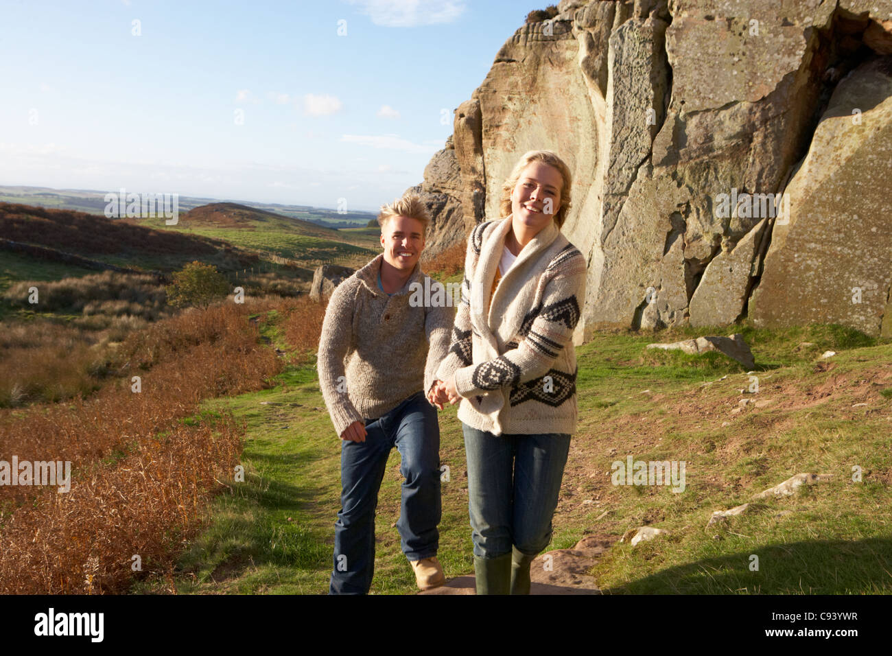 Young couple on country walk Stock Photo - Alamy