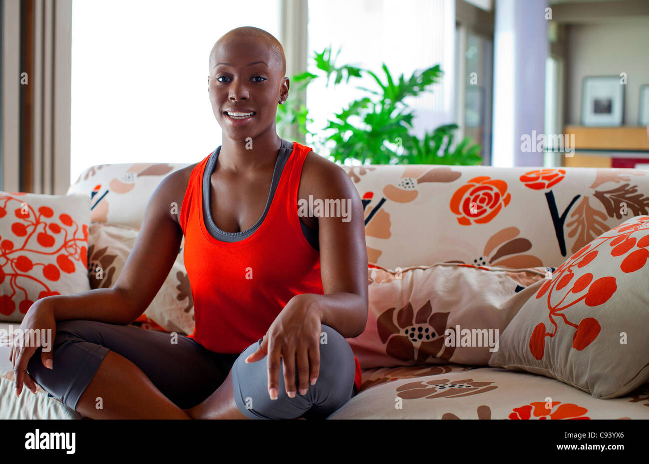 African Woman Sitting Hands On Legs High Resolution Stock Photography ...