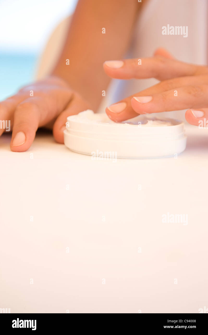 Woman's Hands Getting Cream out of Jar Stock Photo - Alamy