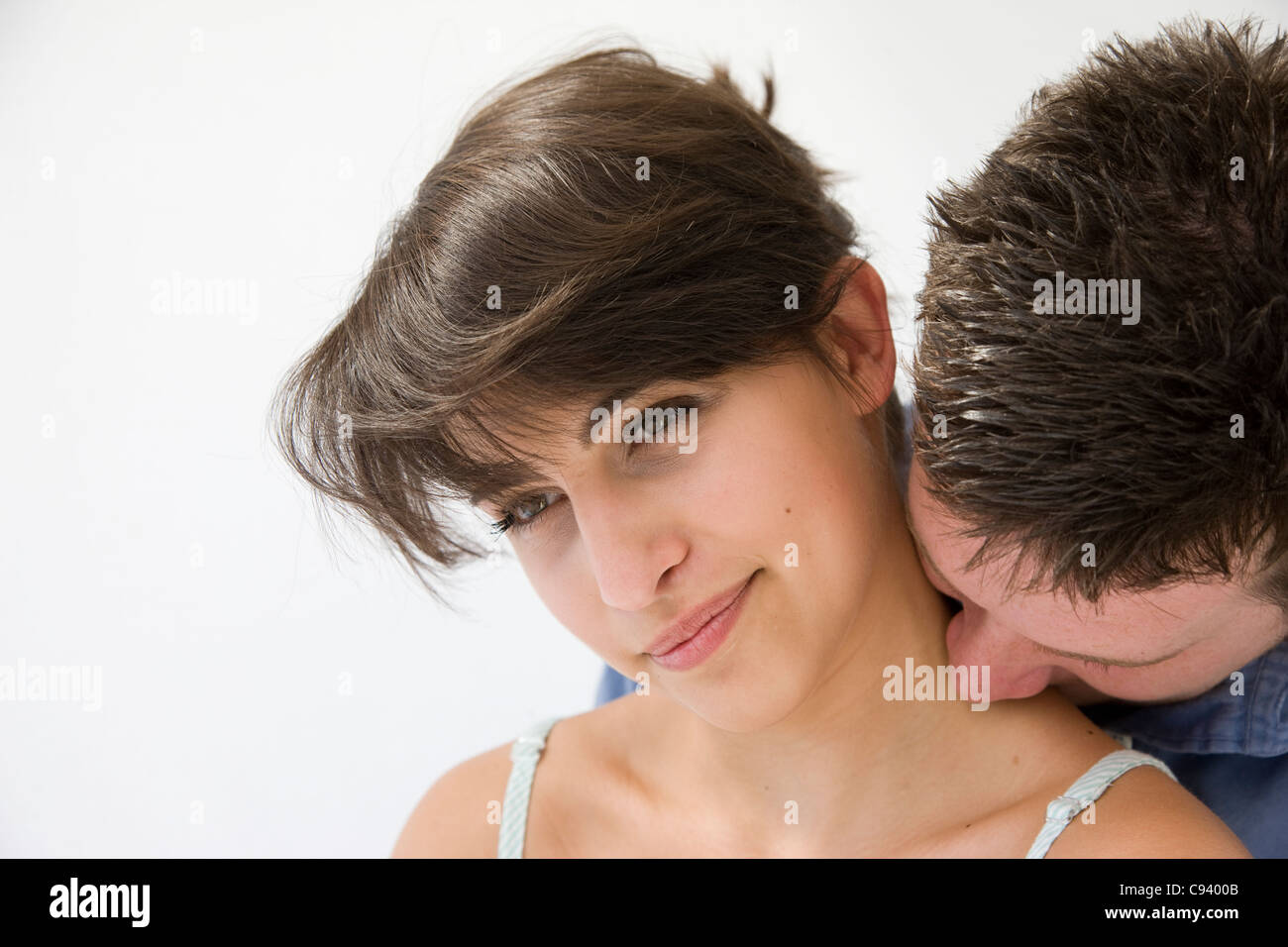 Man Kissing Back of Woman Neck Stock Photo - Alamy