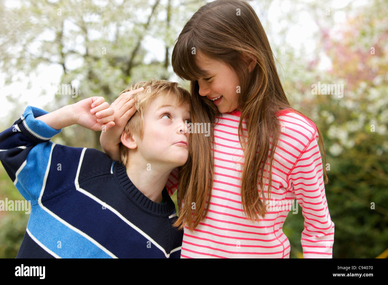 Boy and Girl Messing Around Outdoors Stock Photo - Alamy
