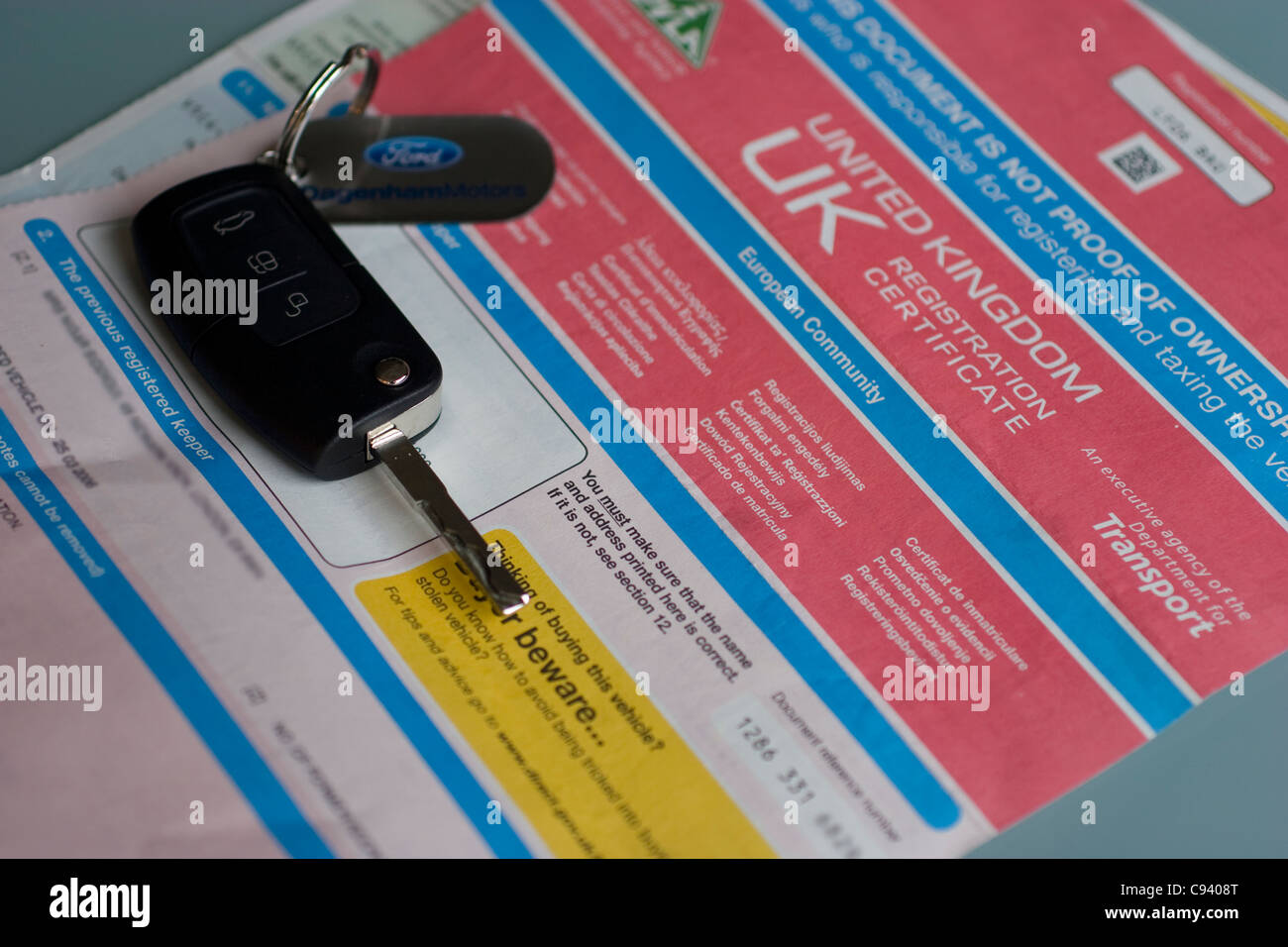 The new-look red V5C form, the UK vehicle registration certificate log book, introduced to ...